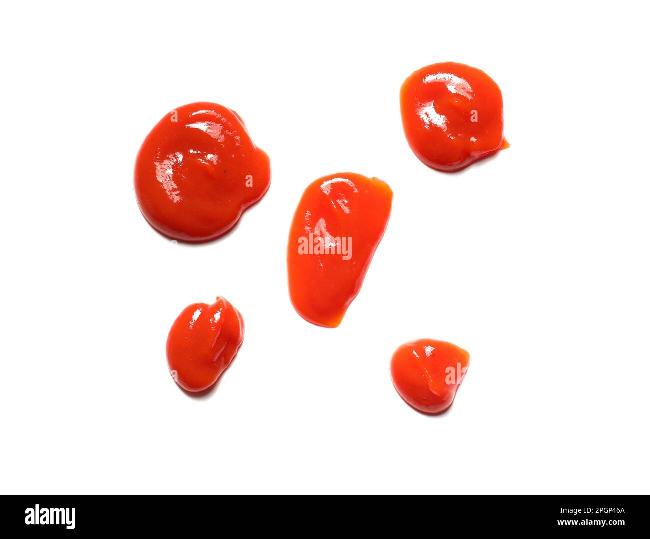 Drops of tasty ketchup isolated on white background Stock Photo - Alamy