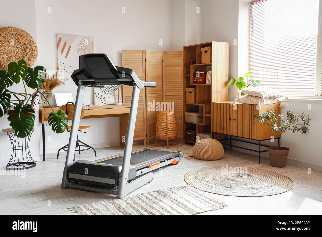 Modern treadmill in interior of modern room Stock Photo - Alamy