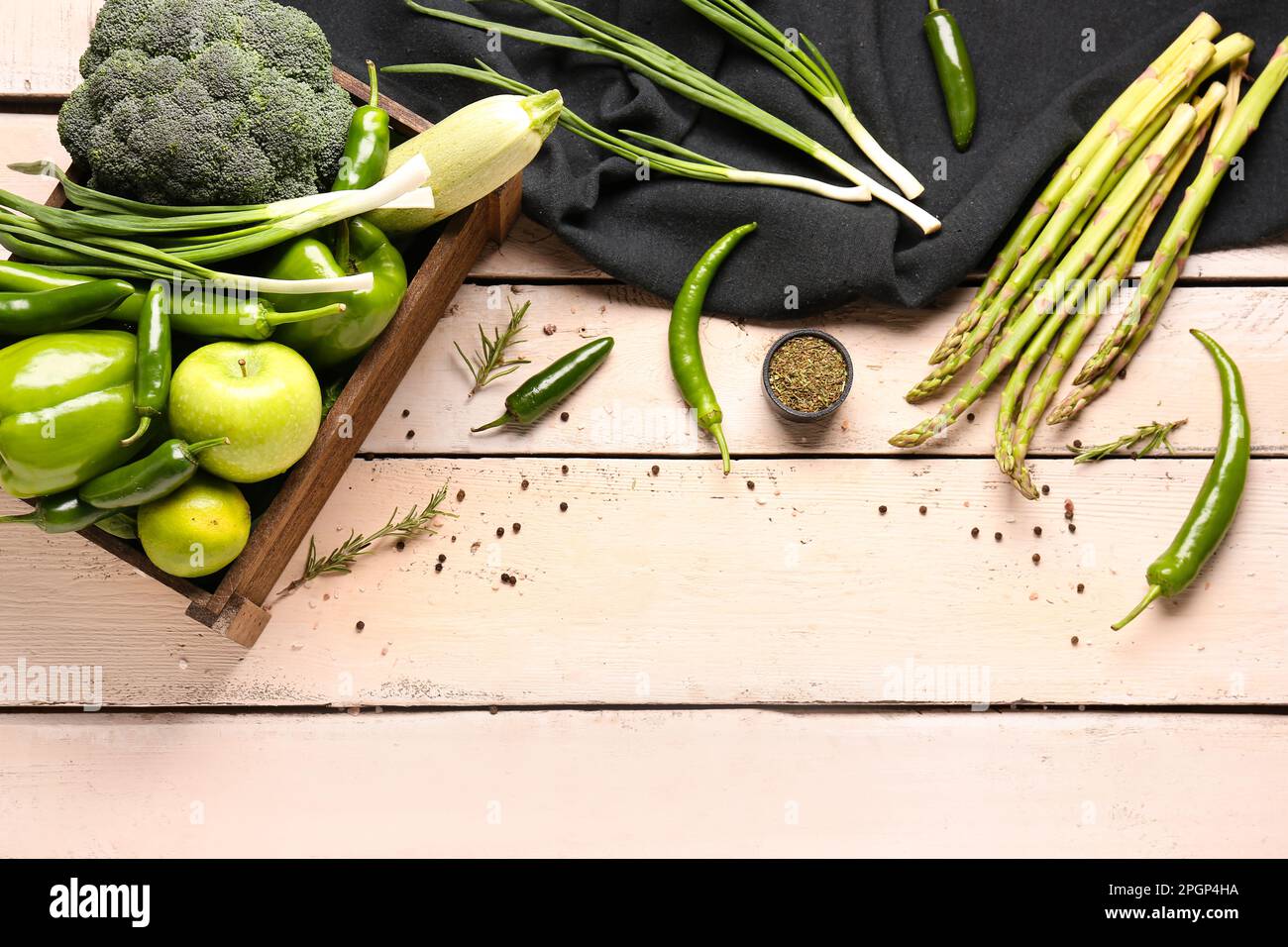 Composition with different fresh green vegetables in box on white wooden background Stock Photo ...