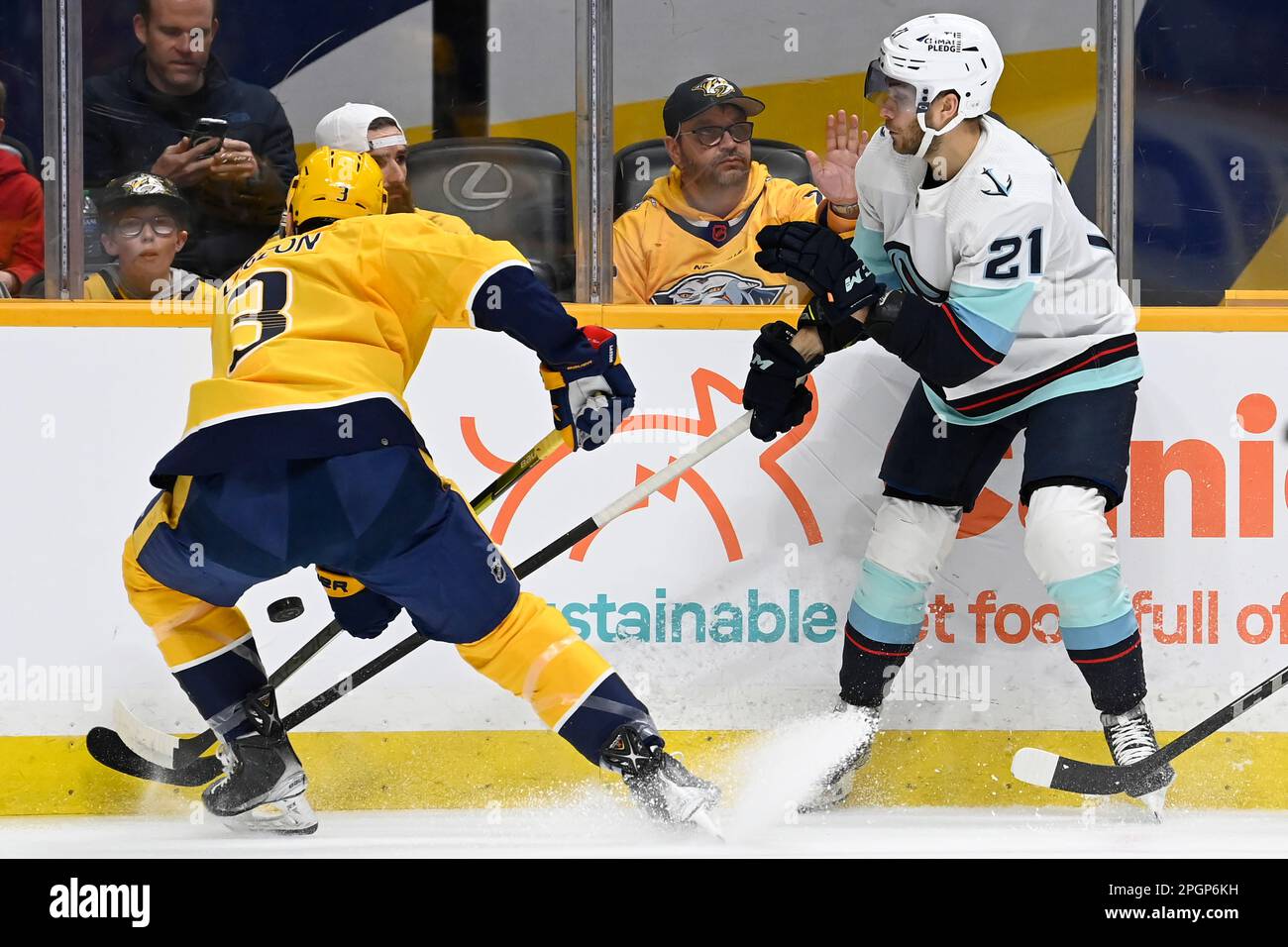 Seattle Kraken center Alex Wennberg (21) and Nashville Predators ...