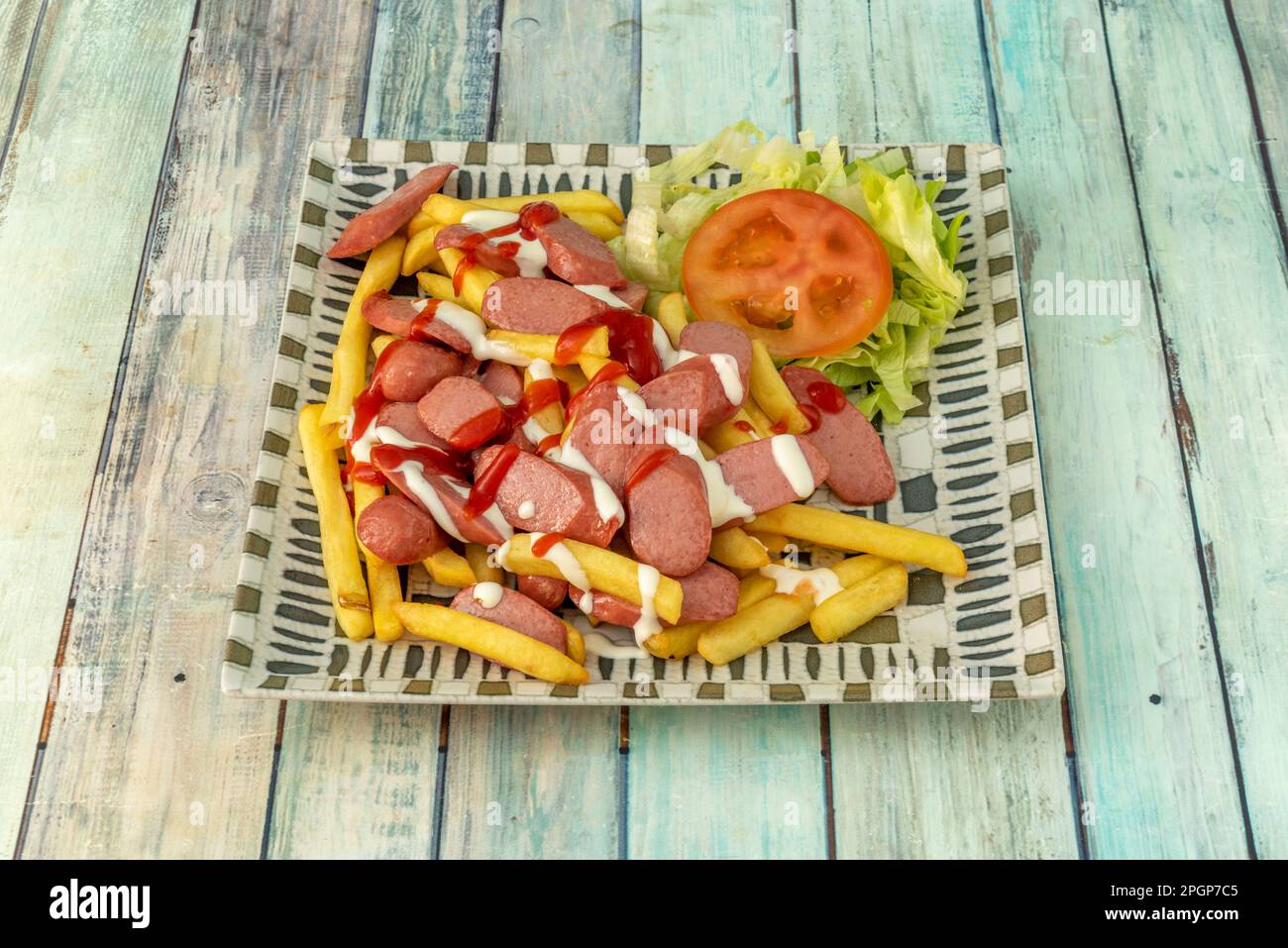 Salchipapa is a fast food consisting of fried slices of sausage and French fries, popular in ...