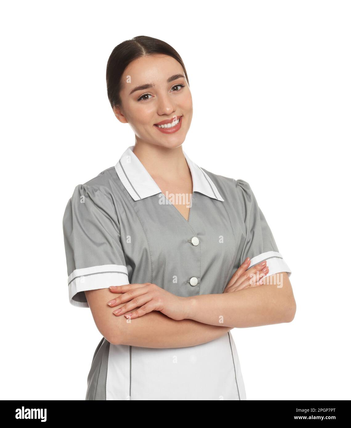 Portrait of young chambermaid in tidy uniform on white background Stock ...