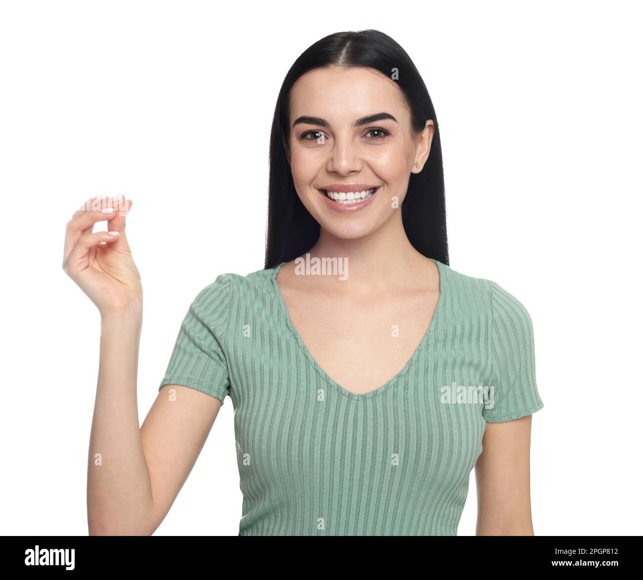 Young woman snapping fingers on white background Stock Photo - Alamy