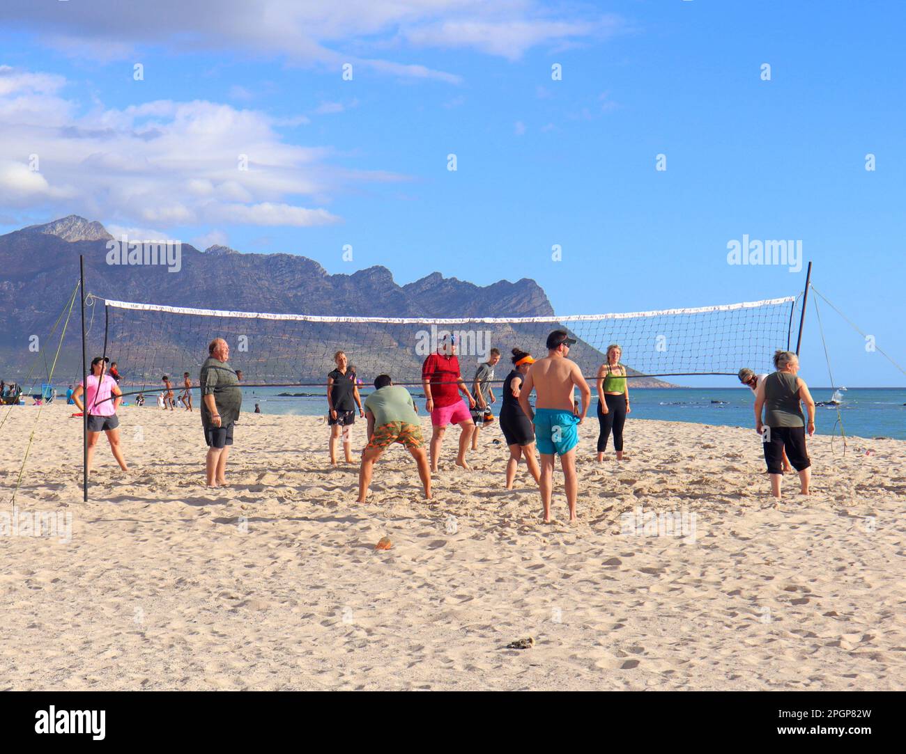 People playing volleyball on the beach Stock Photo - Alamy