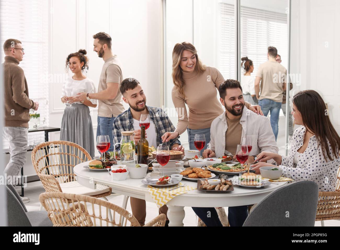 Group of people having brunch together indoors Stock Photo - Alamy