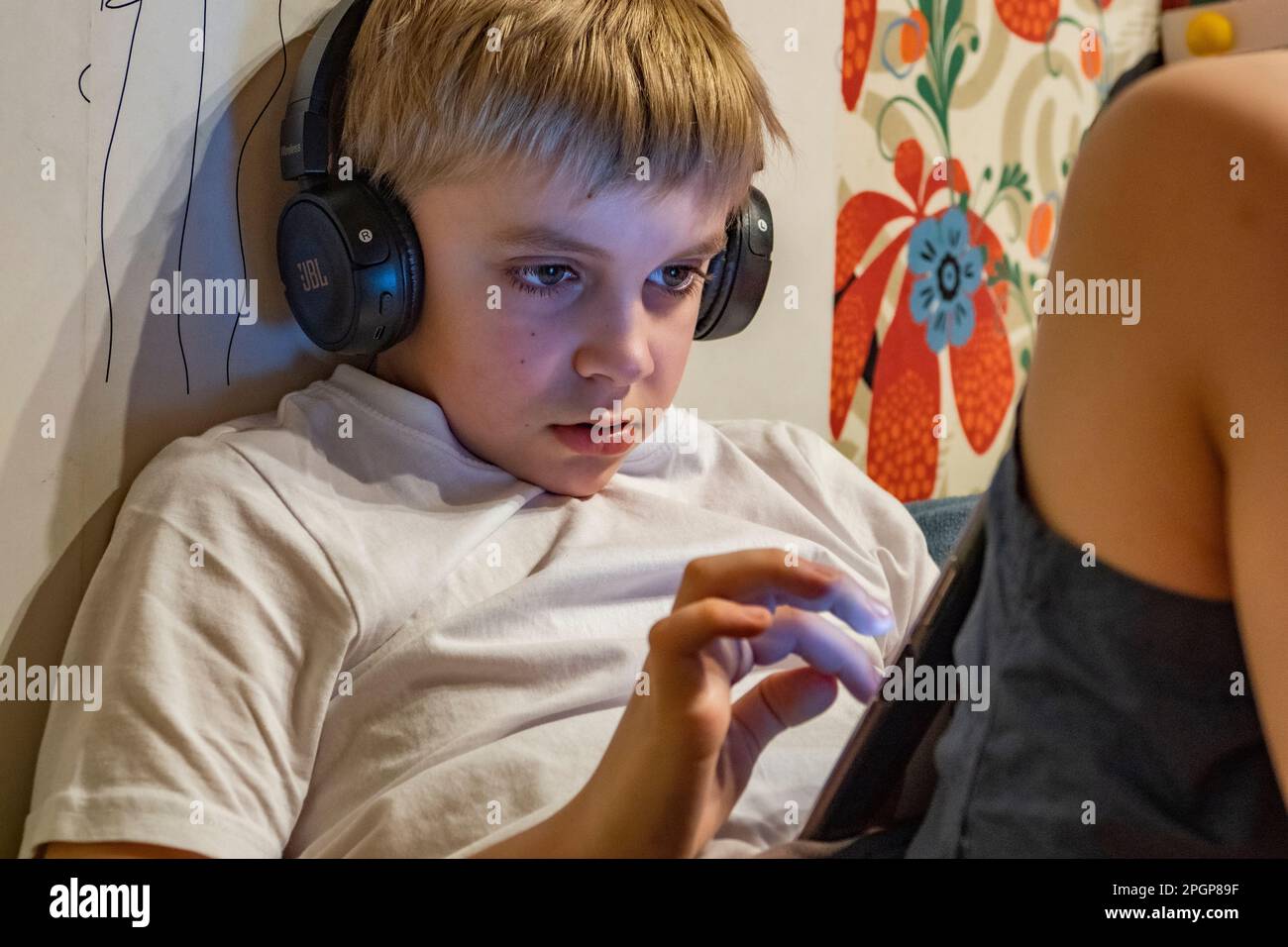 A boy looking at his cell phone Stock Photo - Alamy
