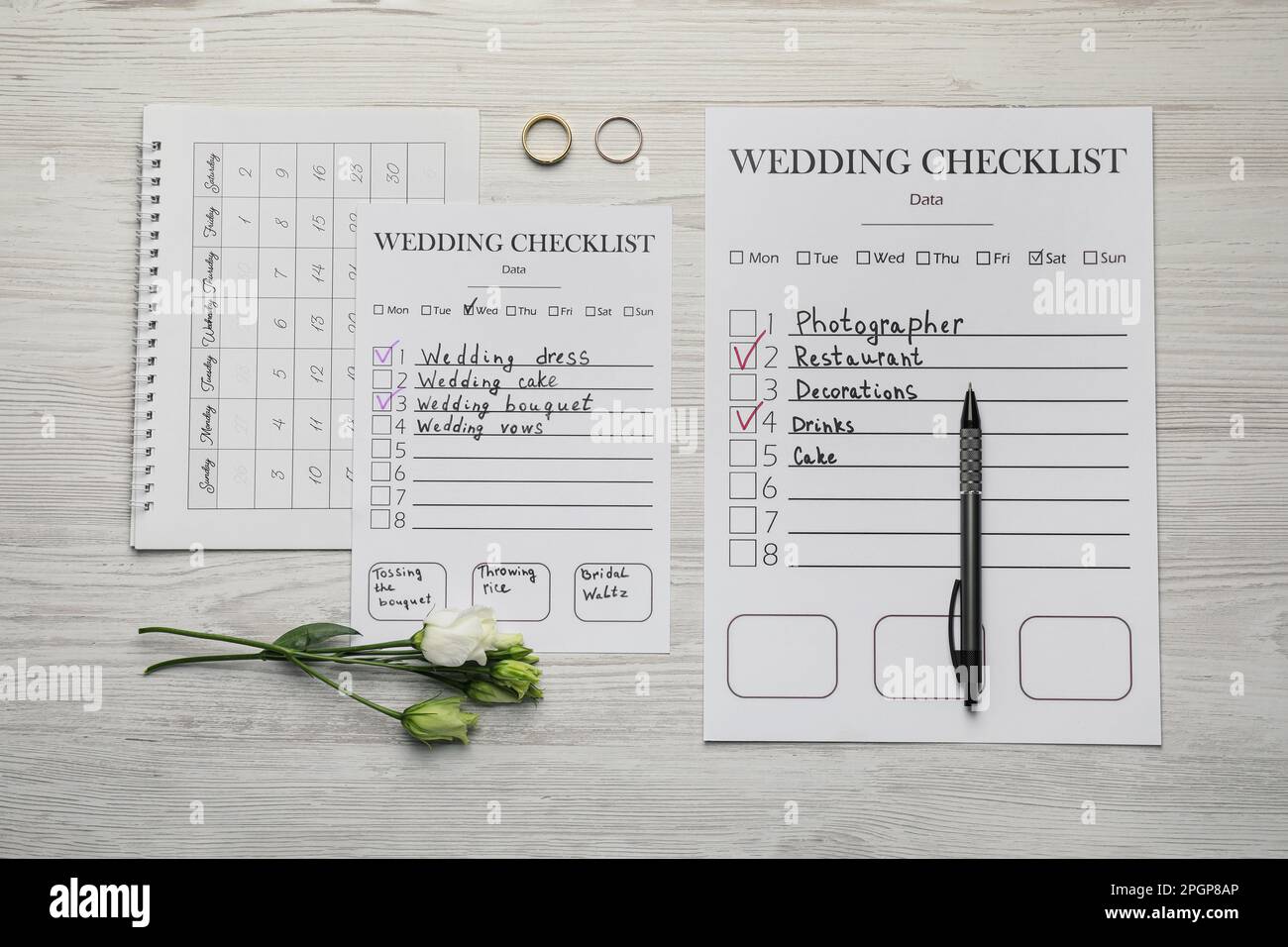Flat lay composition with Wedding Checklists and calendar on white ...