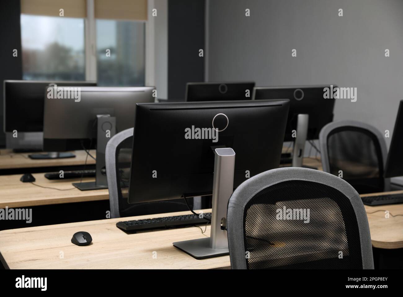 Rows of computers in empty office hi-res stock photography and images ...