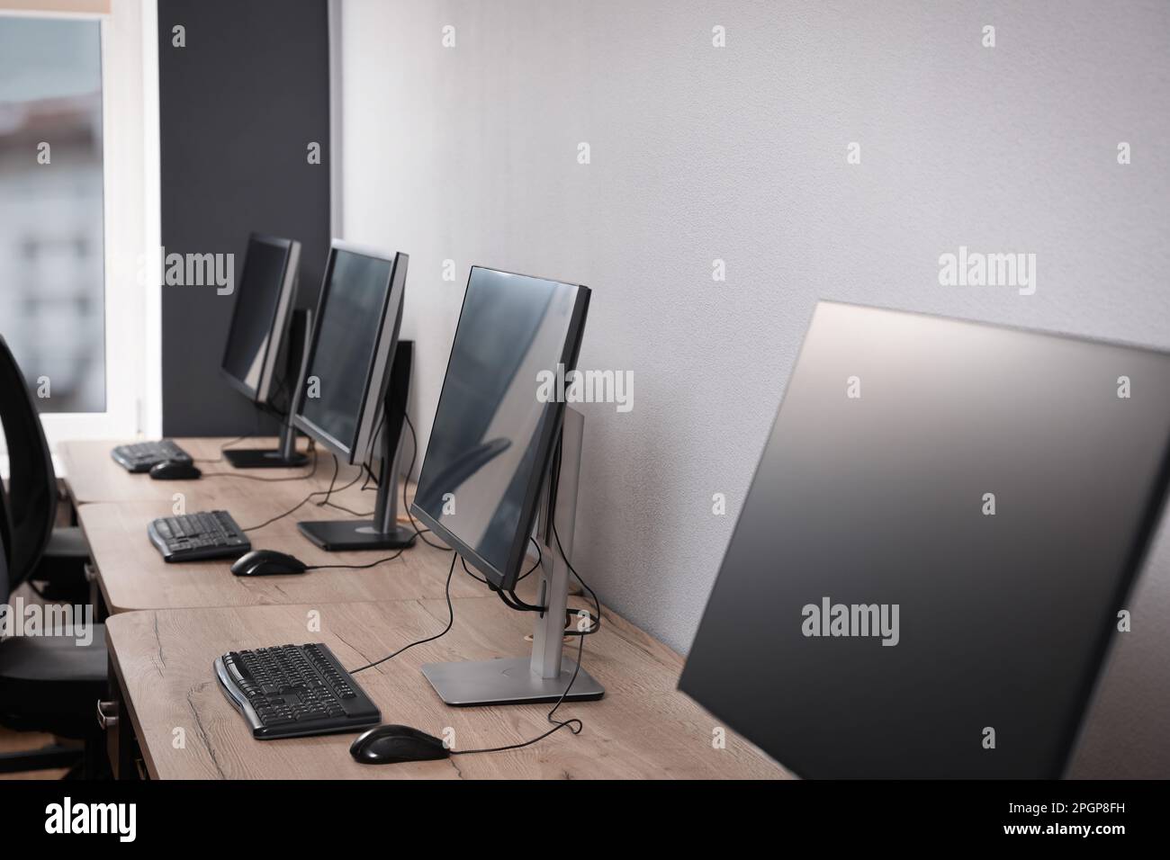 Many modern computers in open space office Stock Photo - Alamy