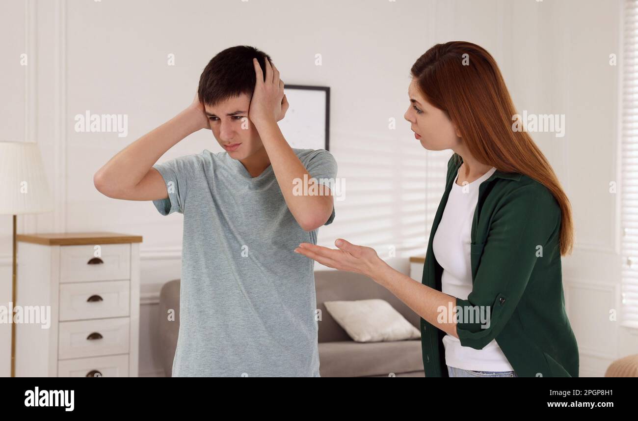 Mother scolding his son at home. Teenager problems Stock Photo - Alamy