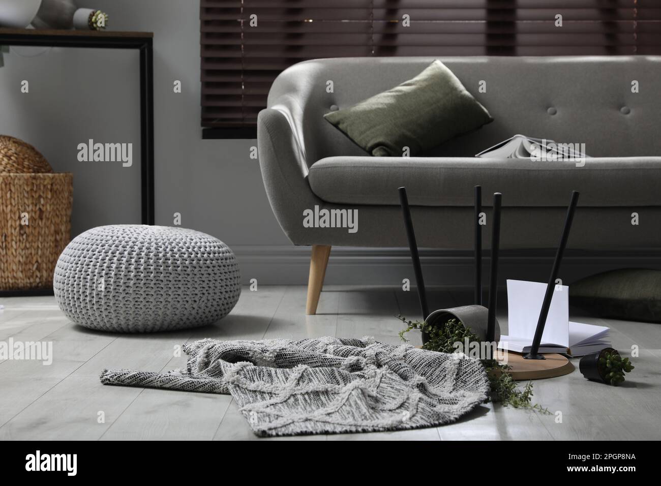 Chaotic living room interior after strong earthquake Stock Photo - Alamy