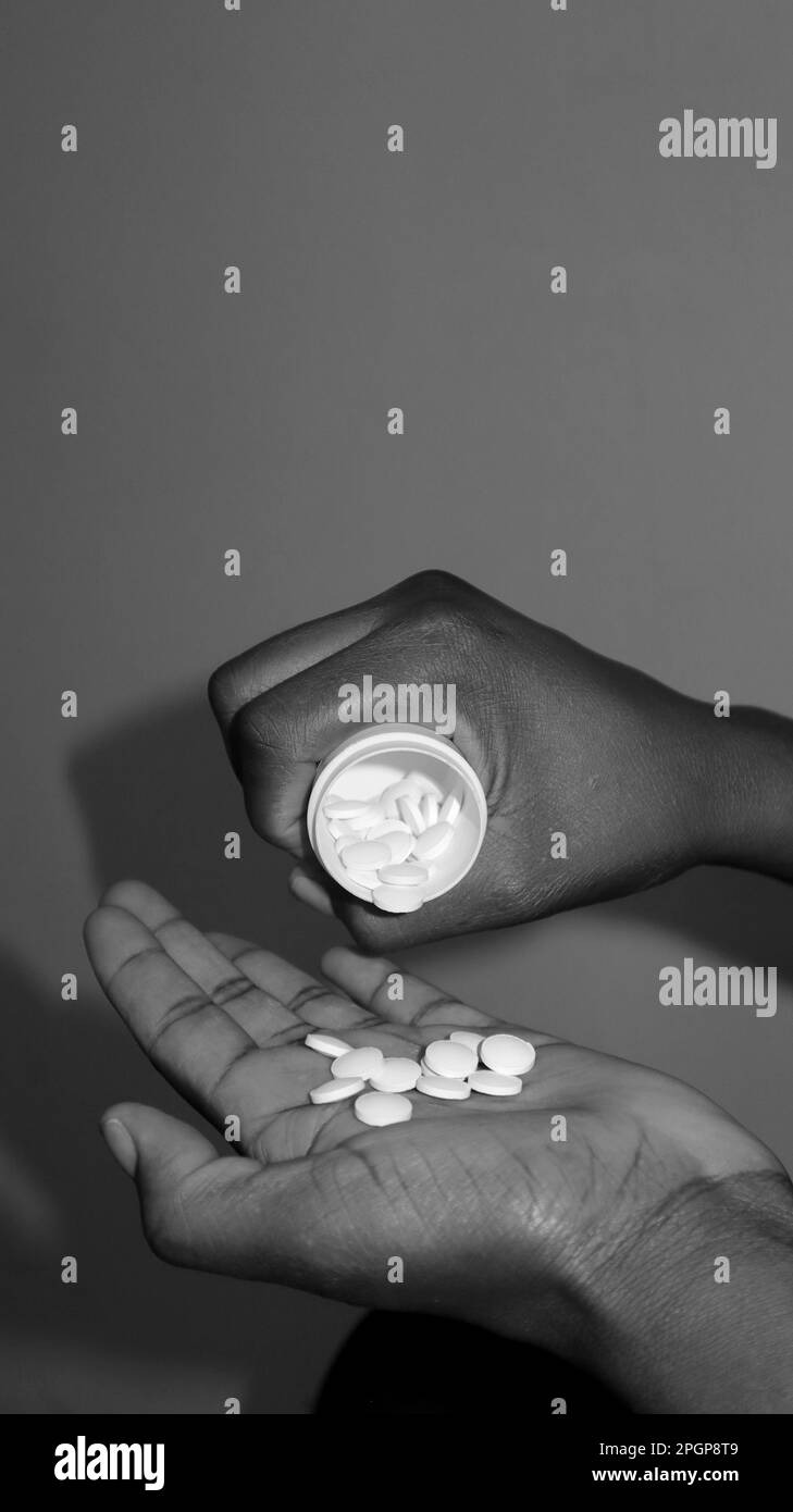 Woman tablets pills Black and White Stock Photos & Images - Alamy