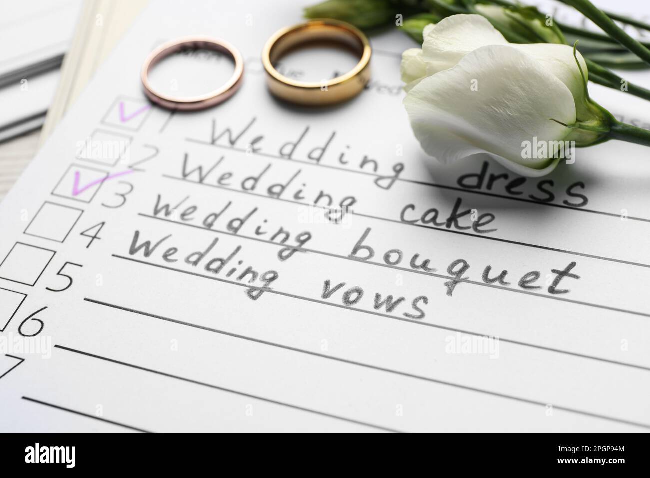 Wedding Checklist, flowers and rings, closeup view Stock Photo - Alamy