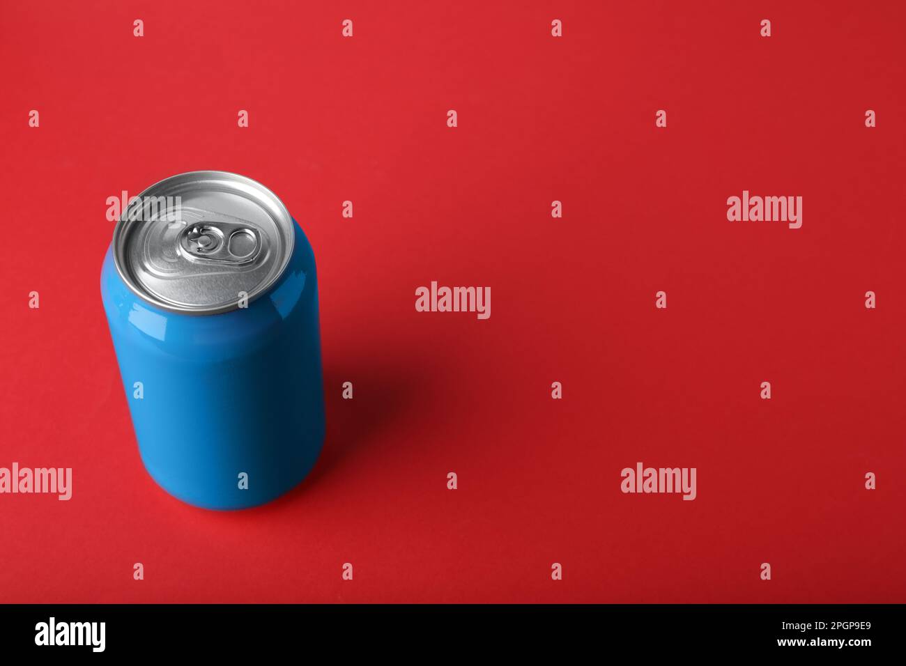 Blue can of energy drink on red background. Space for text Stock Photo ...