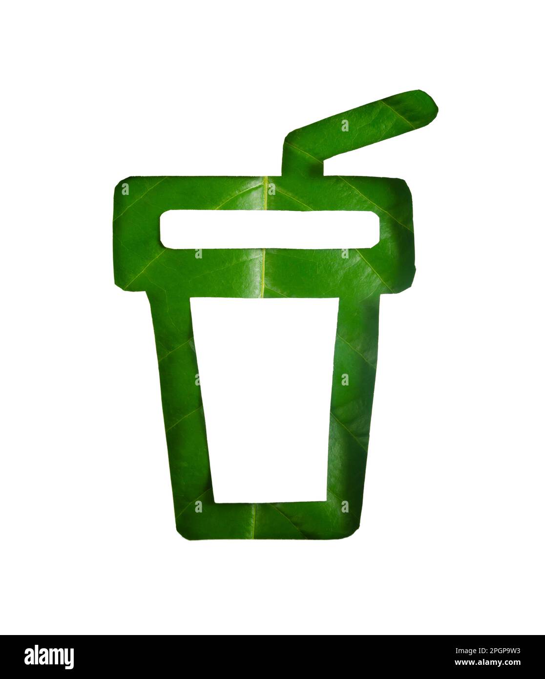 Glass water straw made from paper cutting on leaf green background ...