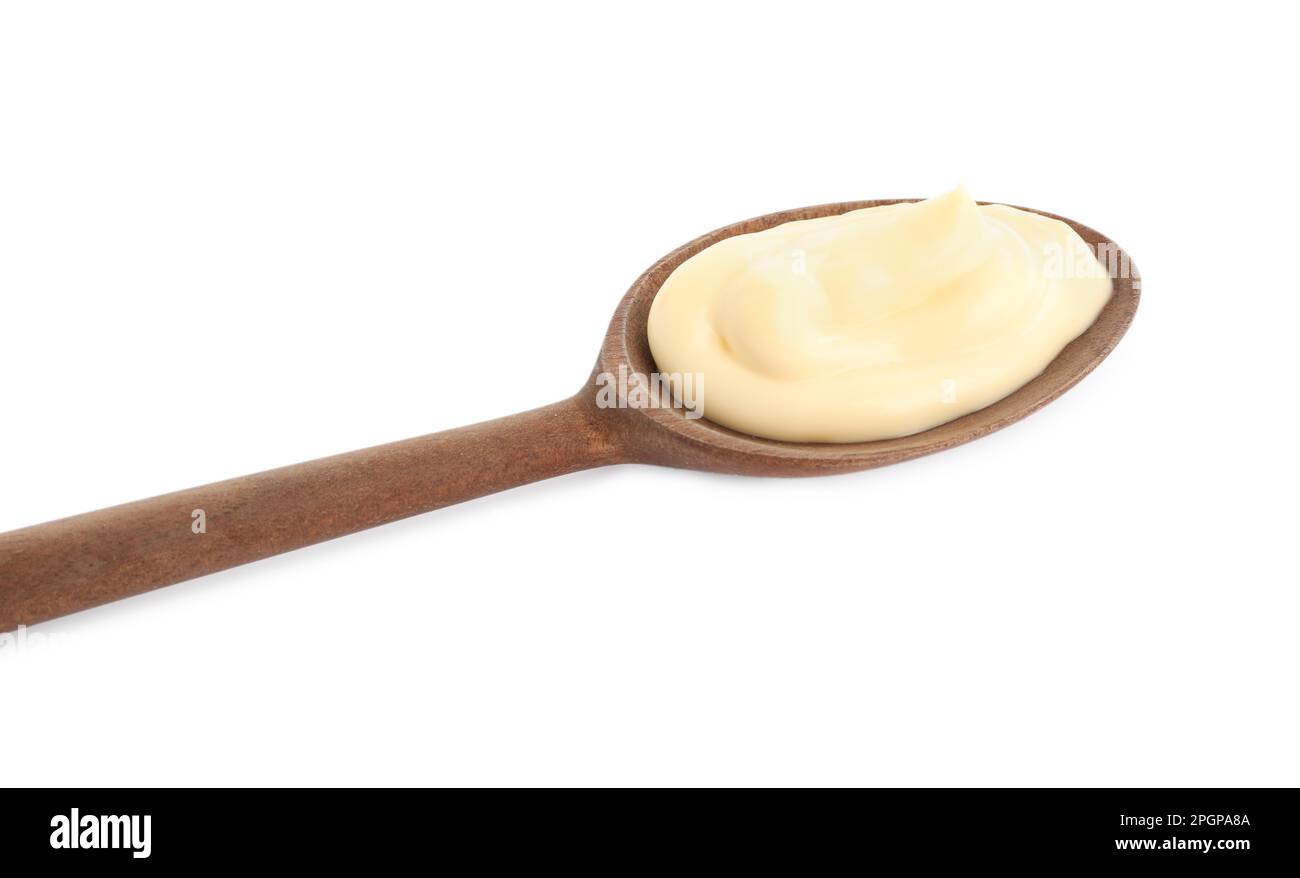 Wooden spoon with tasty mayonnaise isolated on white Stock Photo - Alamy