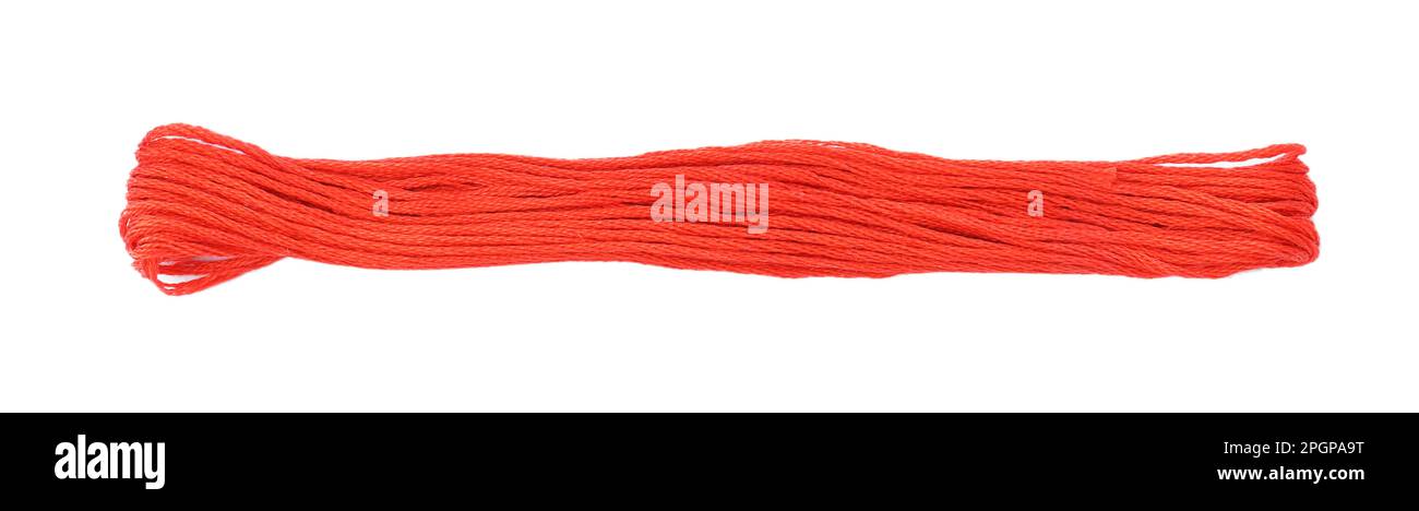 Bright coral embroidery thread on white background Stock Photo - Alamy