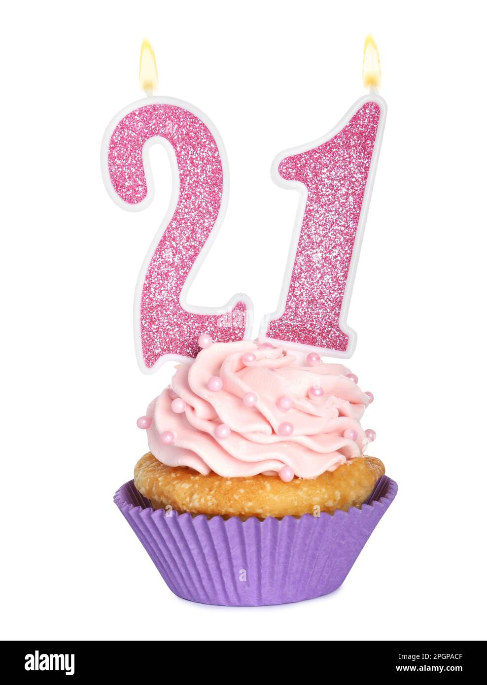 21th birthday. Delicious cupcake with number shaped candles for coming ...