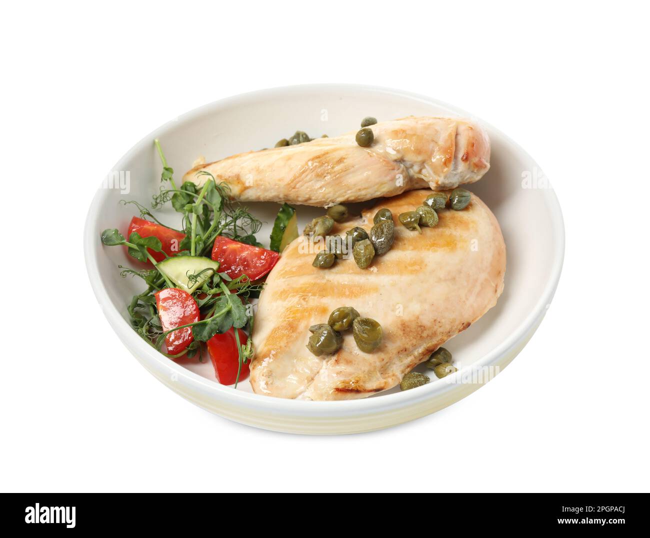 Delicious cooked chicken fillets with capers and salad on white ...