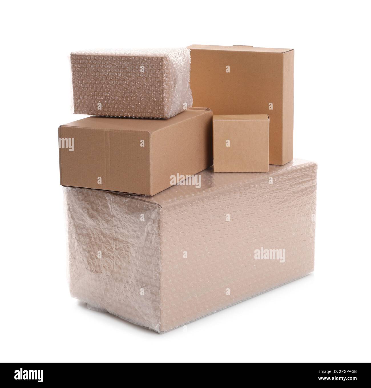 Cardboard boxes packed in bubble wrap and ordinary ones on white ...