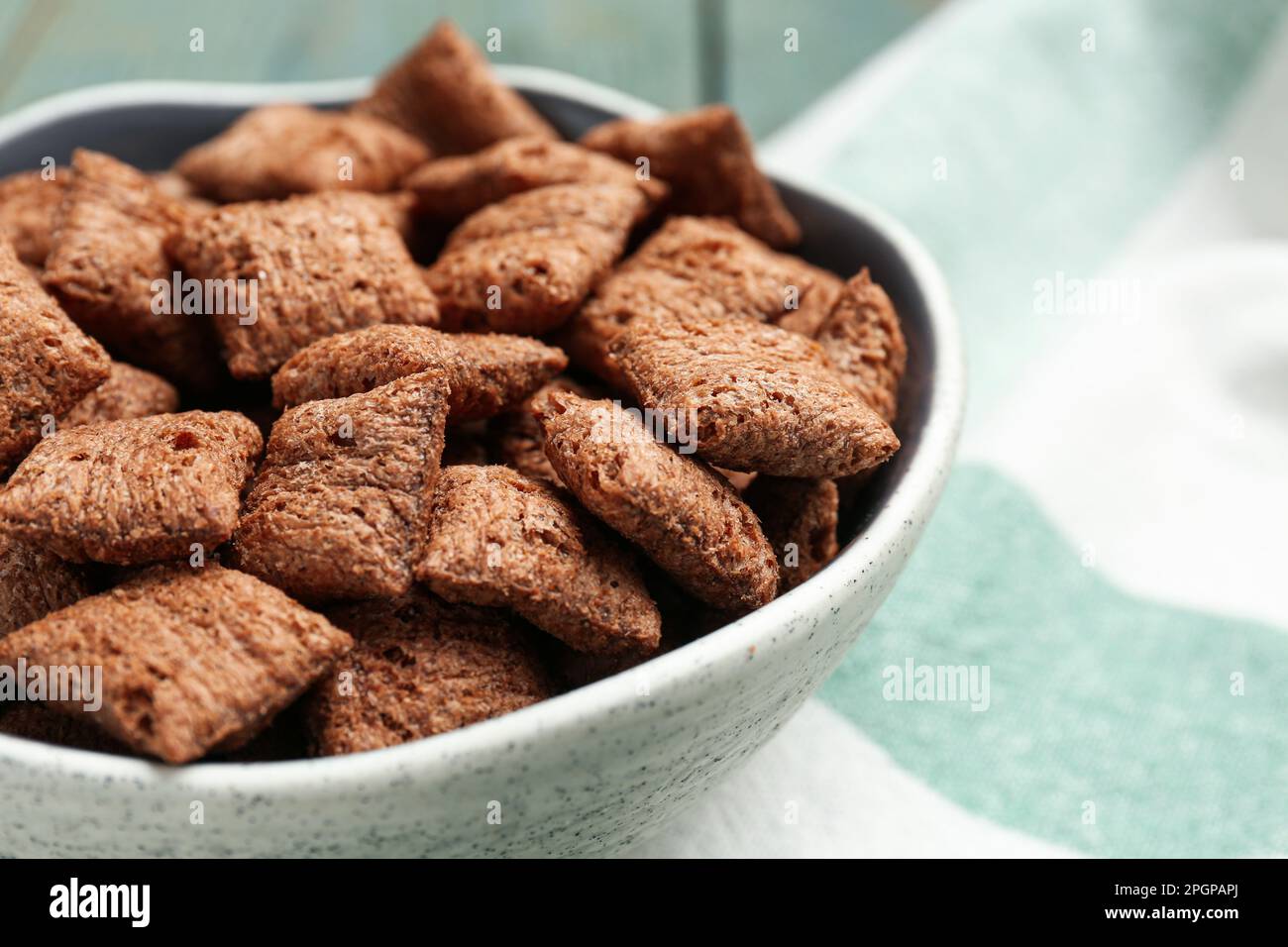 Bowl of sweet crispy corn pads on kitchen towel, closeup. Breakfast ...