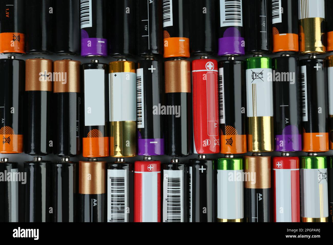 Many new AA batteries as background, top view Stock Photo - Alamy