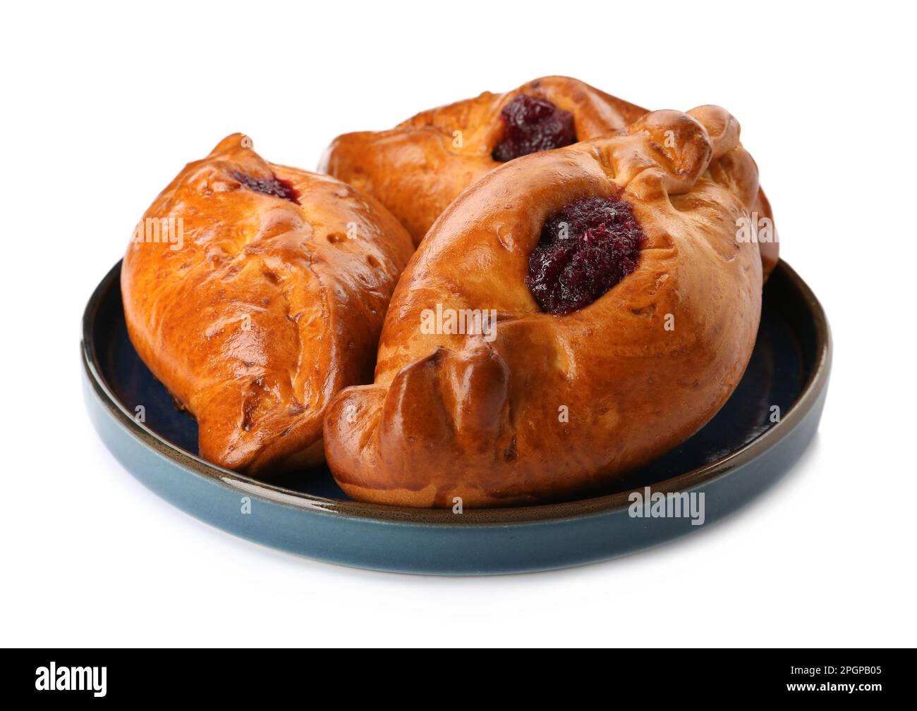 Delicious baked patties with cherry on white background Stock Photo - Alamy