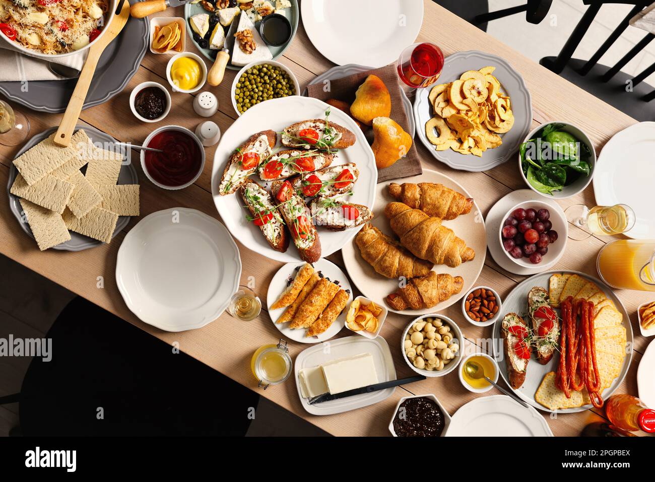 Brunch table setting with different delicious food indoors, top view ...