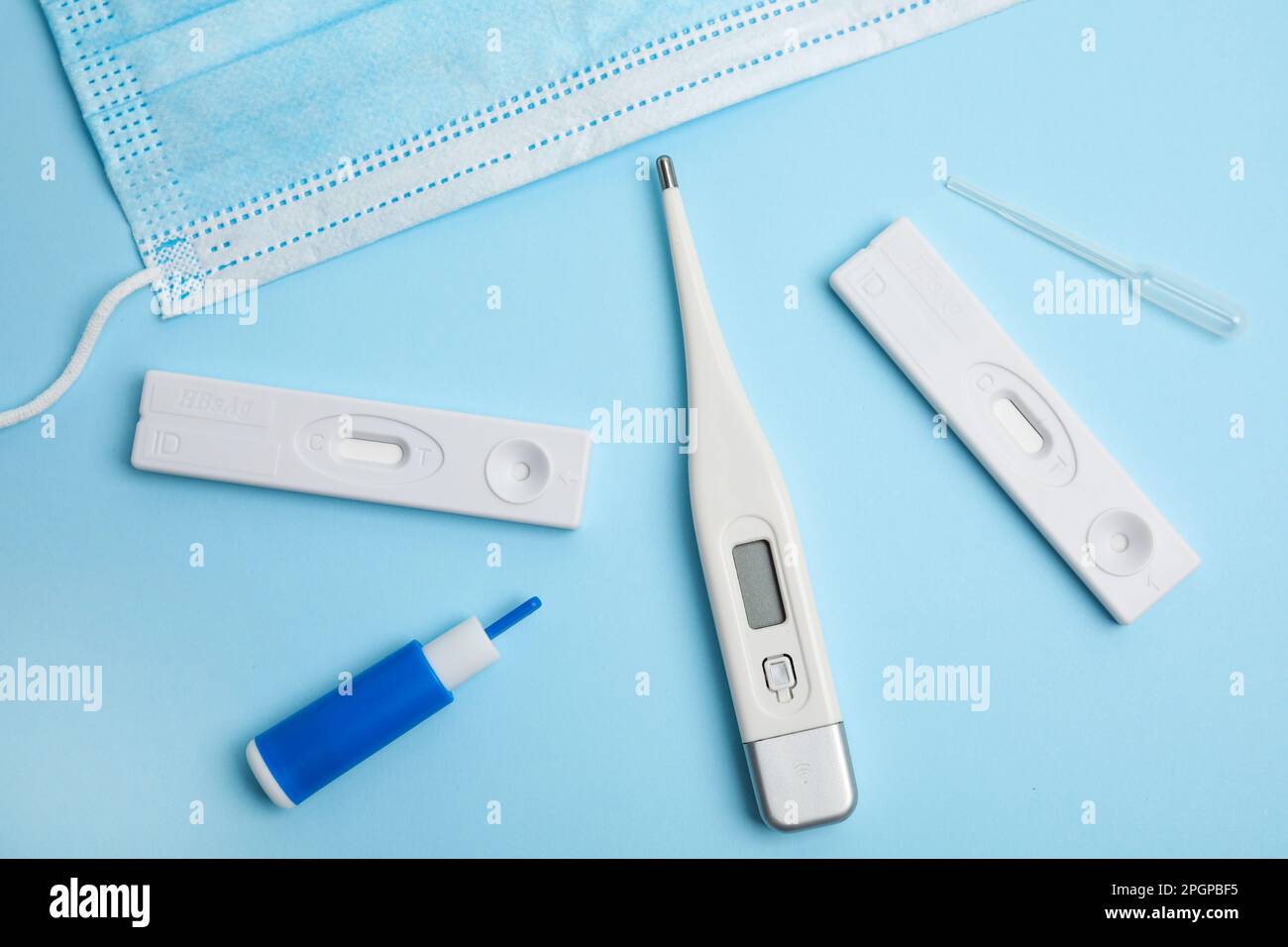 Disposable express test kit for hepatitis on light blue background ...