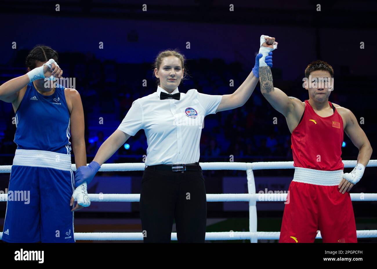 New Delhi, India. 23rd Mar, 2023. China's Yang Chengyu (R) is declared winner against Fatia ...