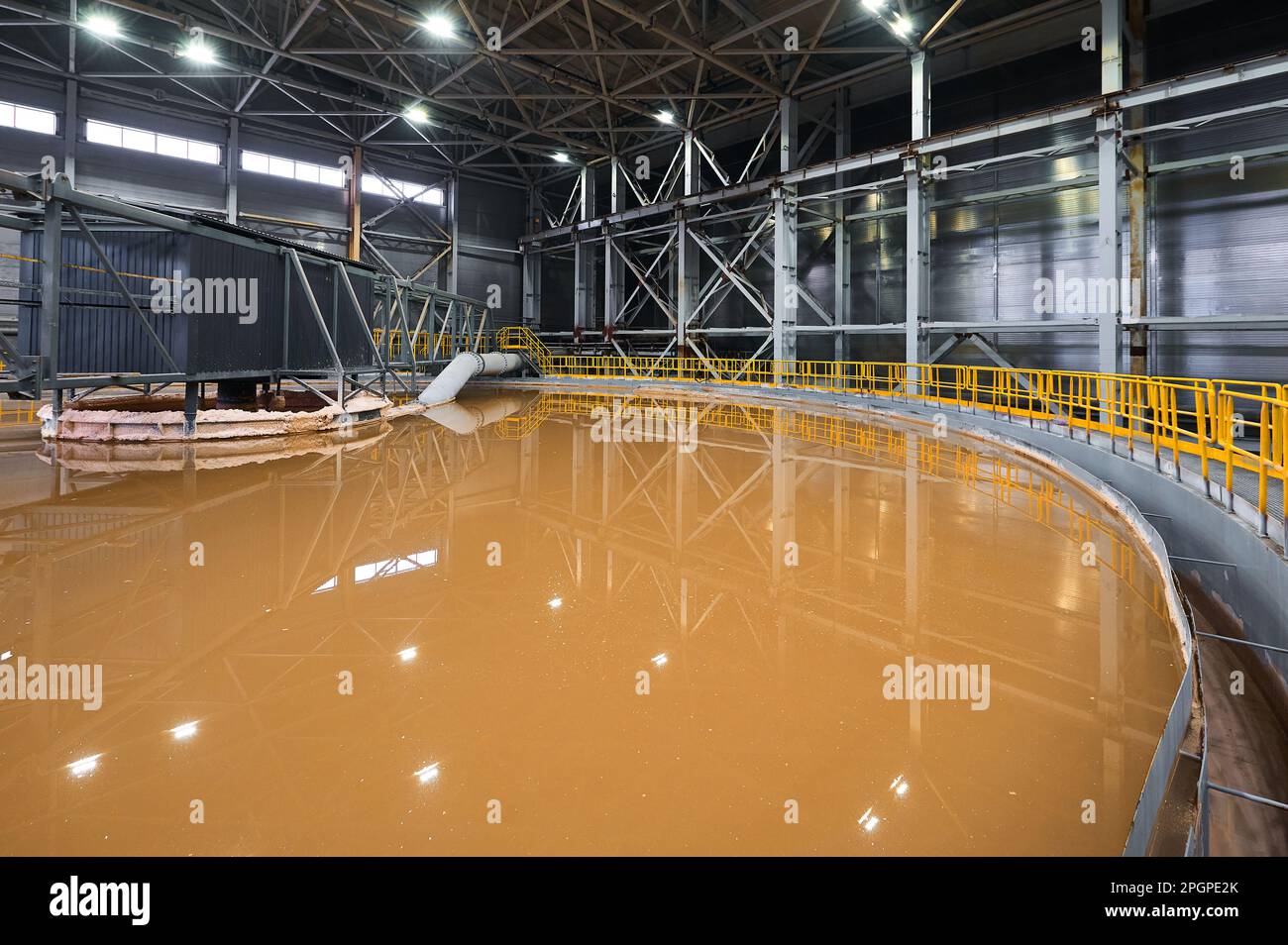 Huge container to separate liquid pulp material in workshop Stock Photo ...