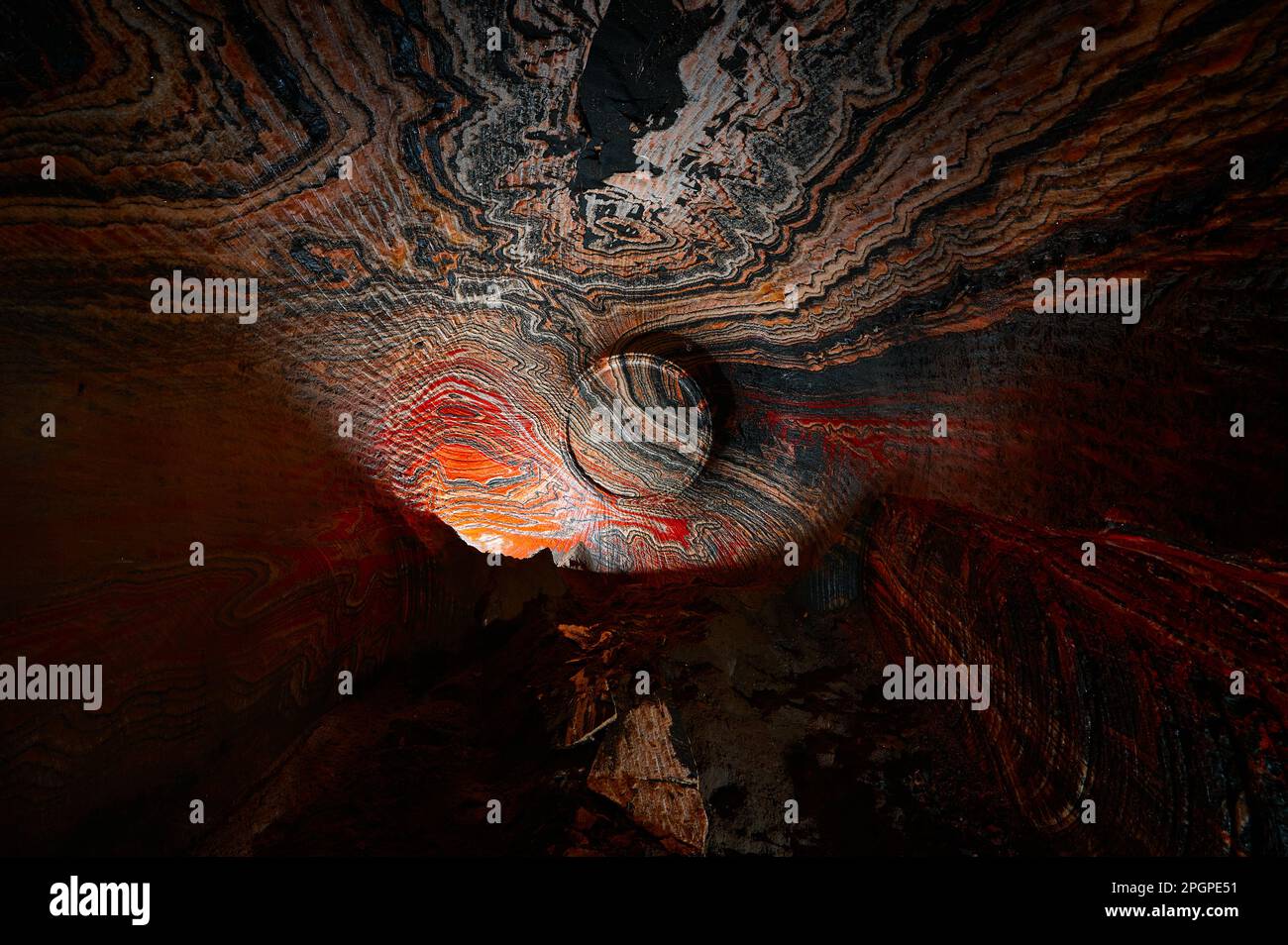 Red and orange patterns on ceiling of sylvinite salt quarry Stock Photo ...