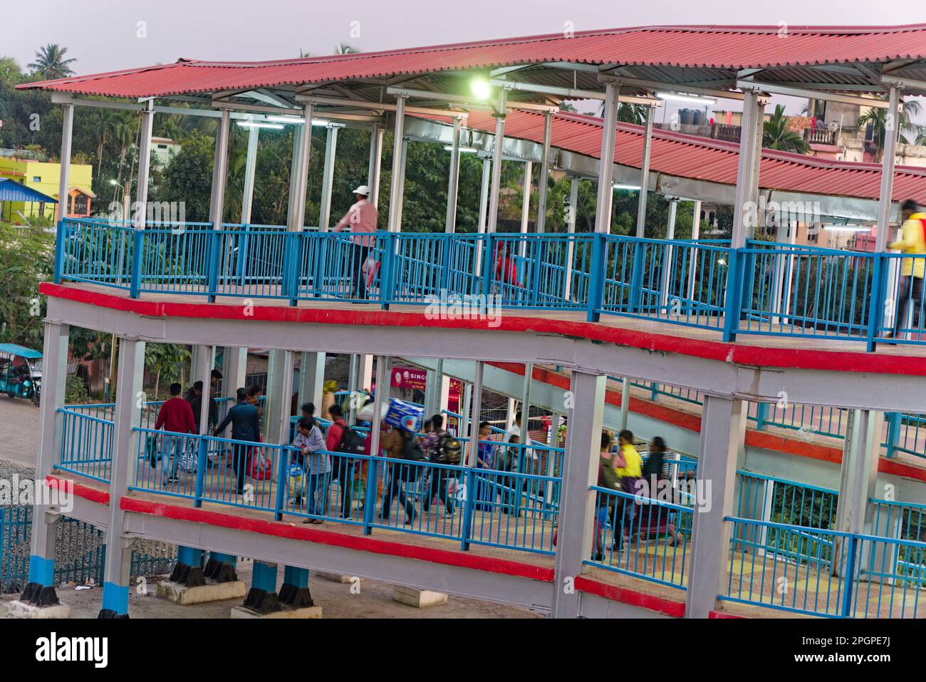 a 'rail over bridge in night time with passengers walk by Stock Photo ...