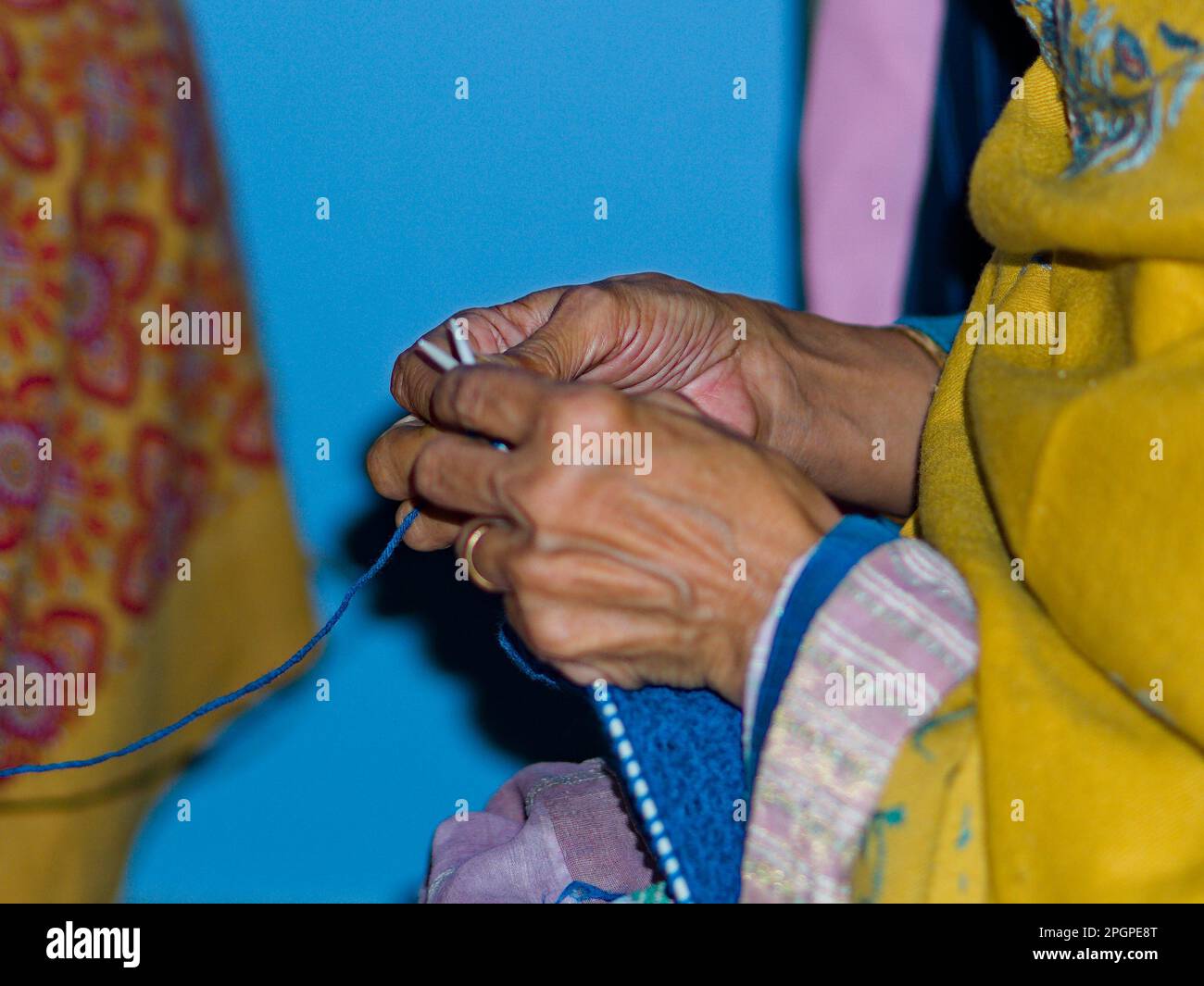 an old woman knitting woolen sweater Stock Photo - Alamy