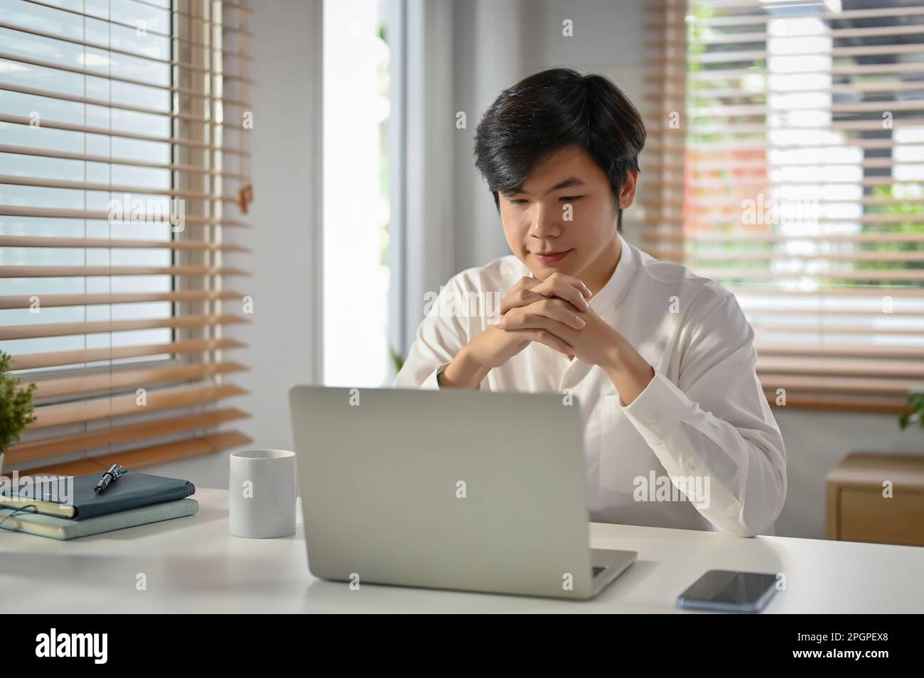 Asian male banker using hi-res stock photography and images - Alamy