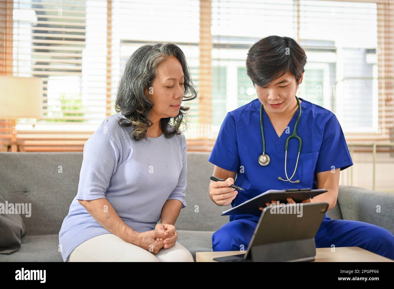 A happy and relaxed 60-year-old retired Asian woman has a medical ...