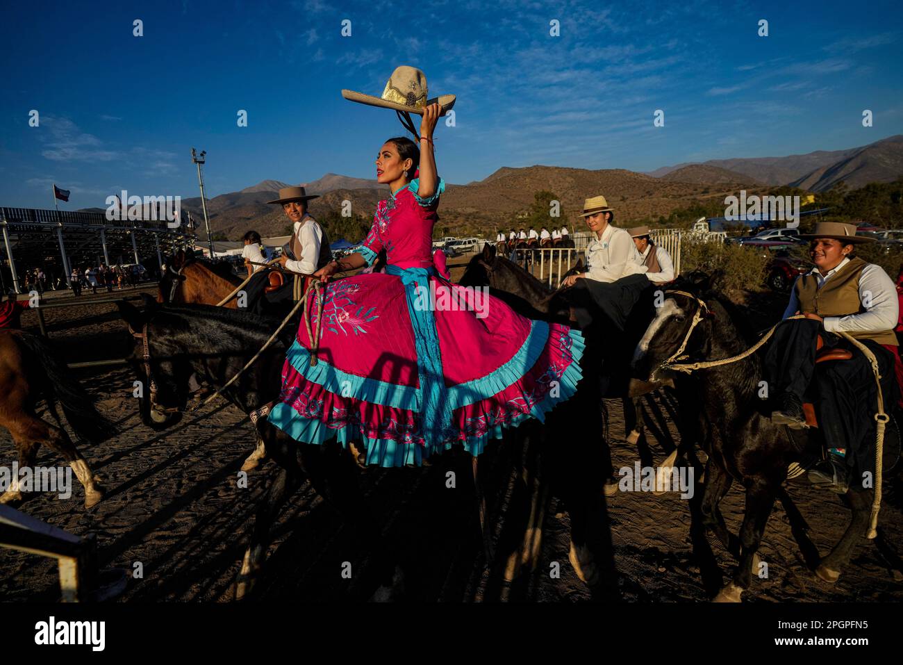 A Mexican female rider raises her hat during the first Colina ...