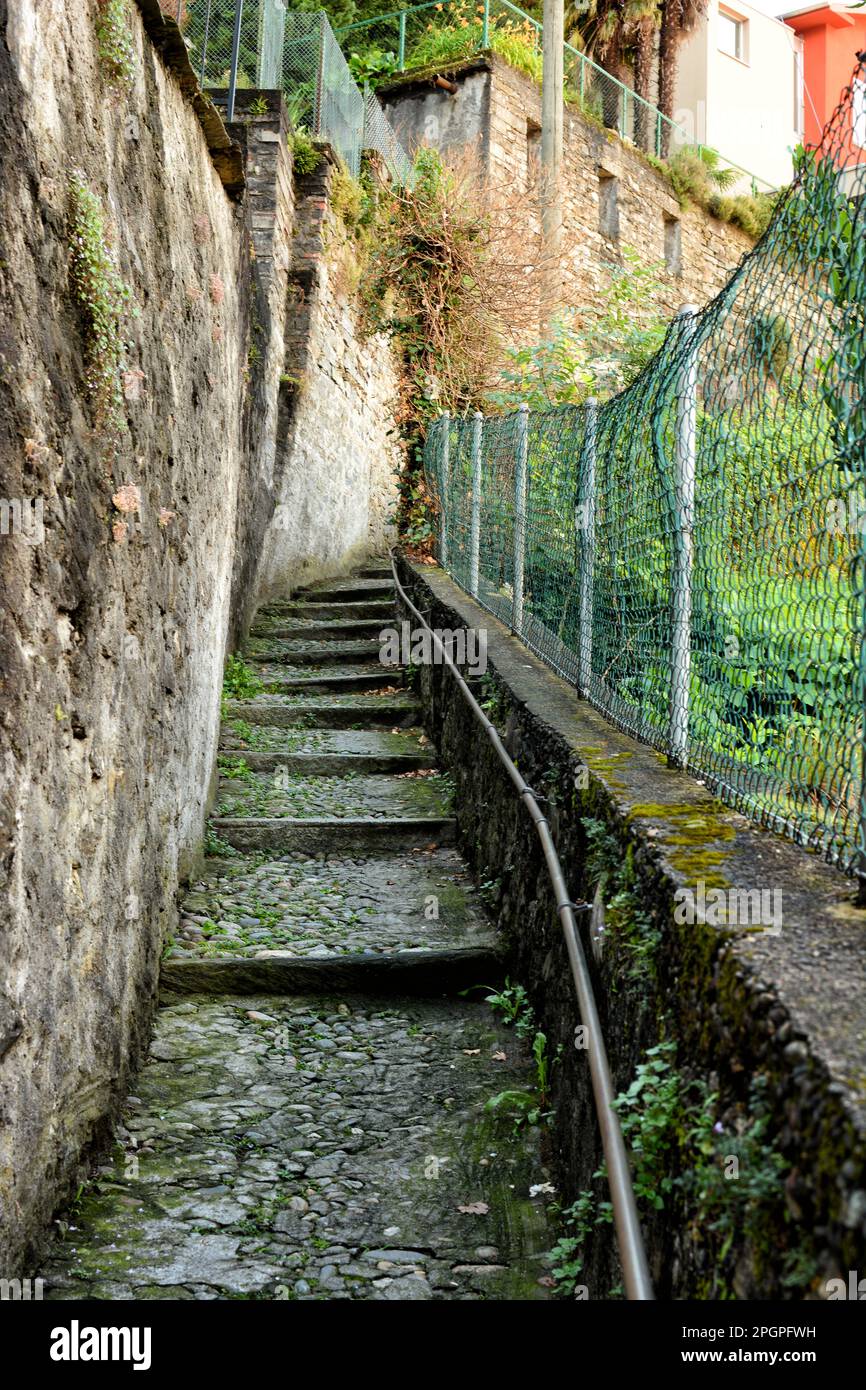 Narrow footpath leading to Montebello Castle in the medieval town of ...