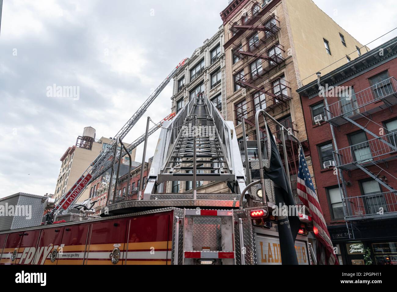 Rescue operation by firefighters to extinguish 2-alarm fire on ...