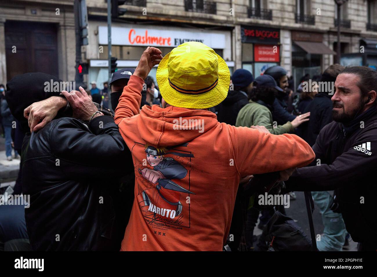 Paris, France. 23rd Mar, 2023. Two protesters fight each other under ...