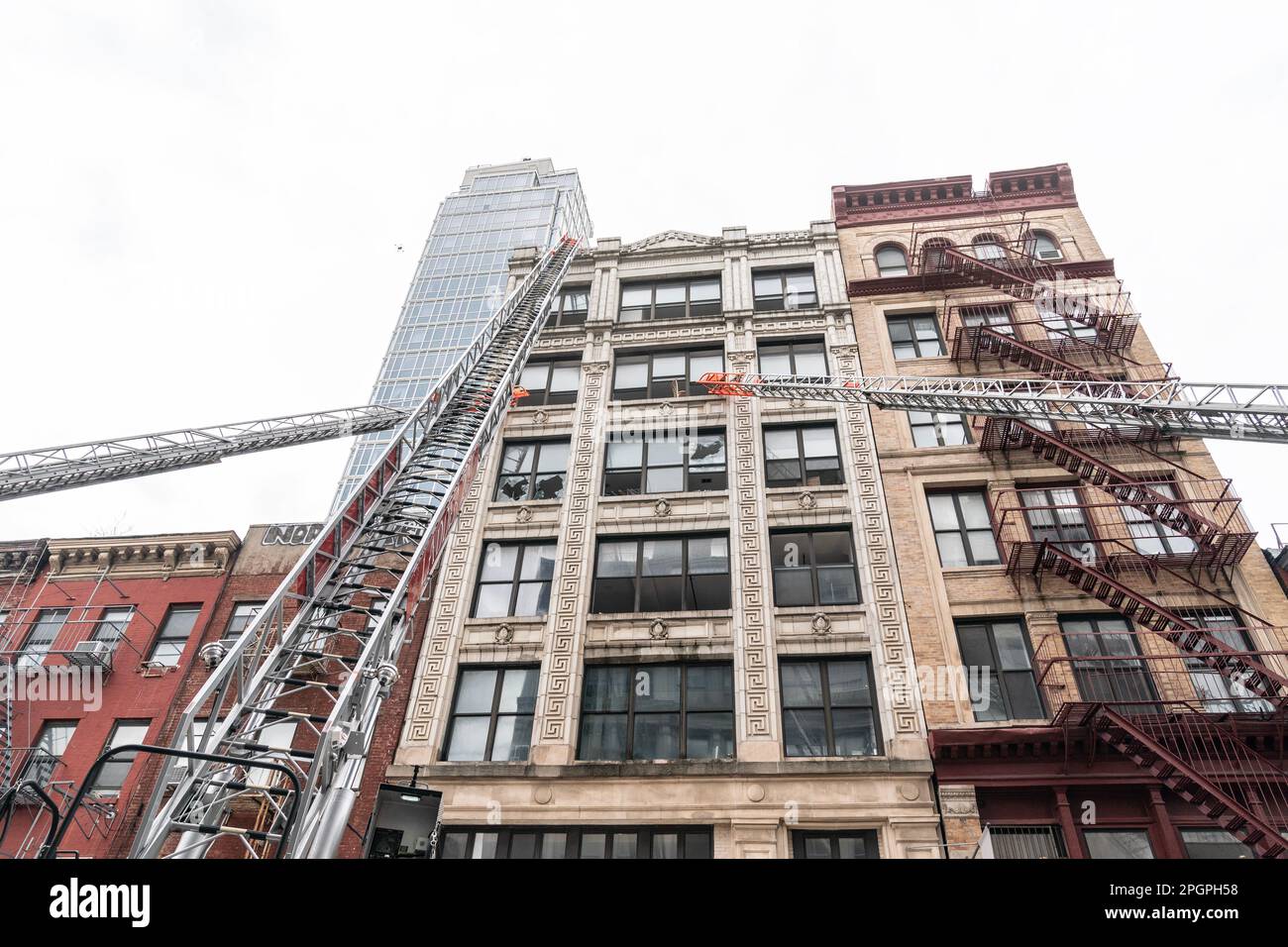 Rescue operation by firefighters to extinguish 2-alarm fire on ...