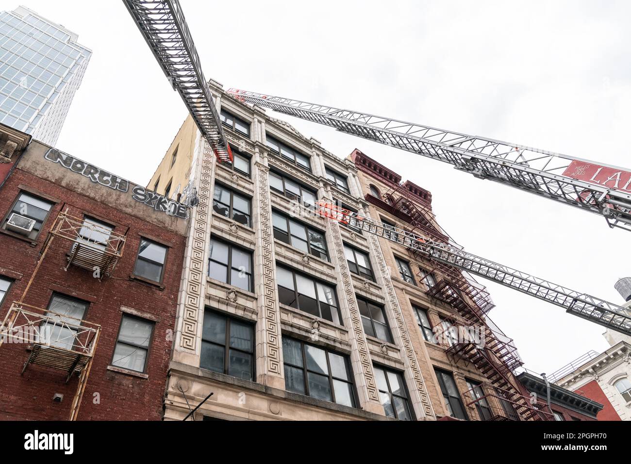 Rescue operation by firefighters to extinguish 2-alarm fire on ...