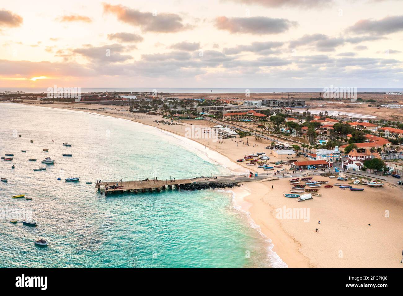Pier and boats on turquoise water in city of Santa Maria, island of Sal ...