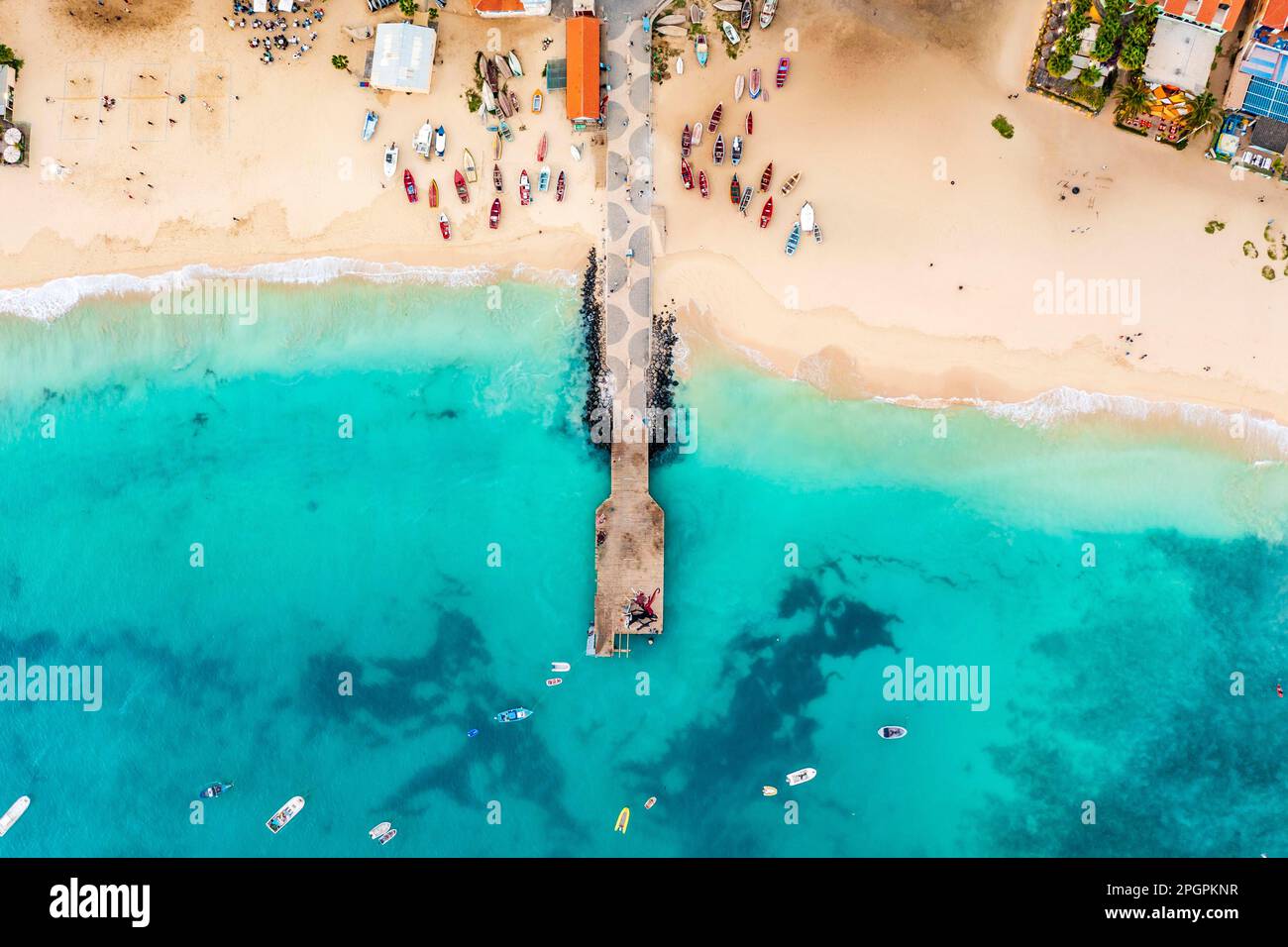 Pier and boats on turquoise water in city of Santa Maria, island of Sal ...