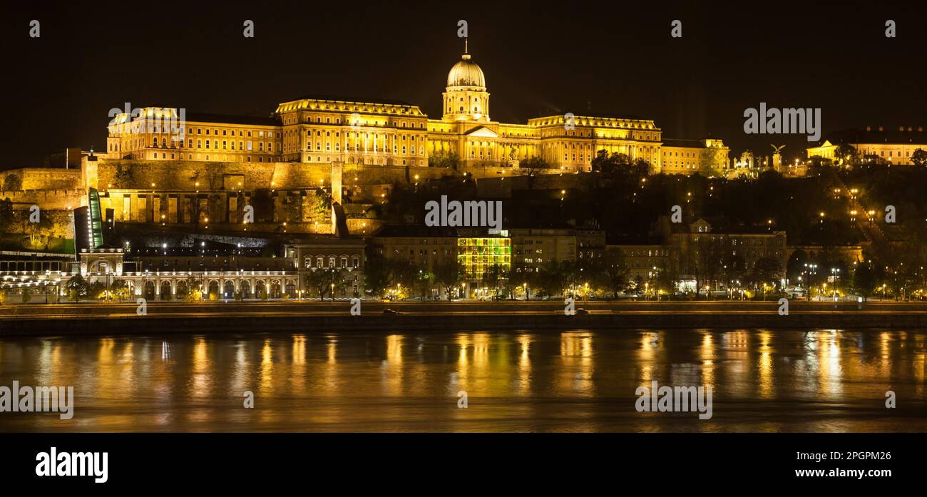 Budapest Castle by night in on Danube river Stock Photo - Alamy