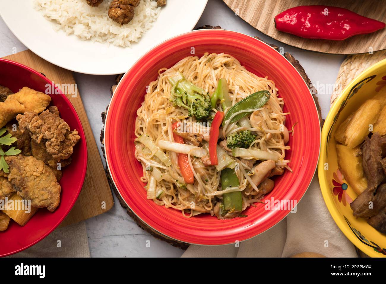 Sauted noodles with vegetables Peruvian food buffet table Assorted ...