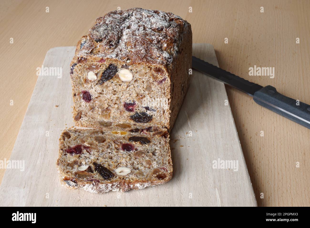 whole-grain fruit and nut bread from Germany on cutting board Stock ...