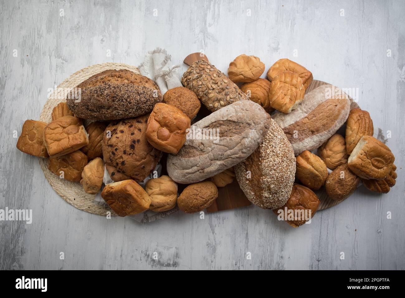 Types of bread on a wooden table Stock Photo - Alamy