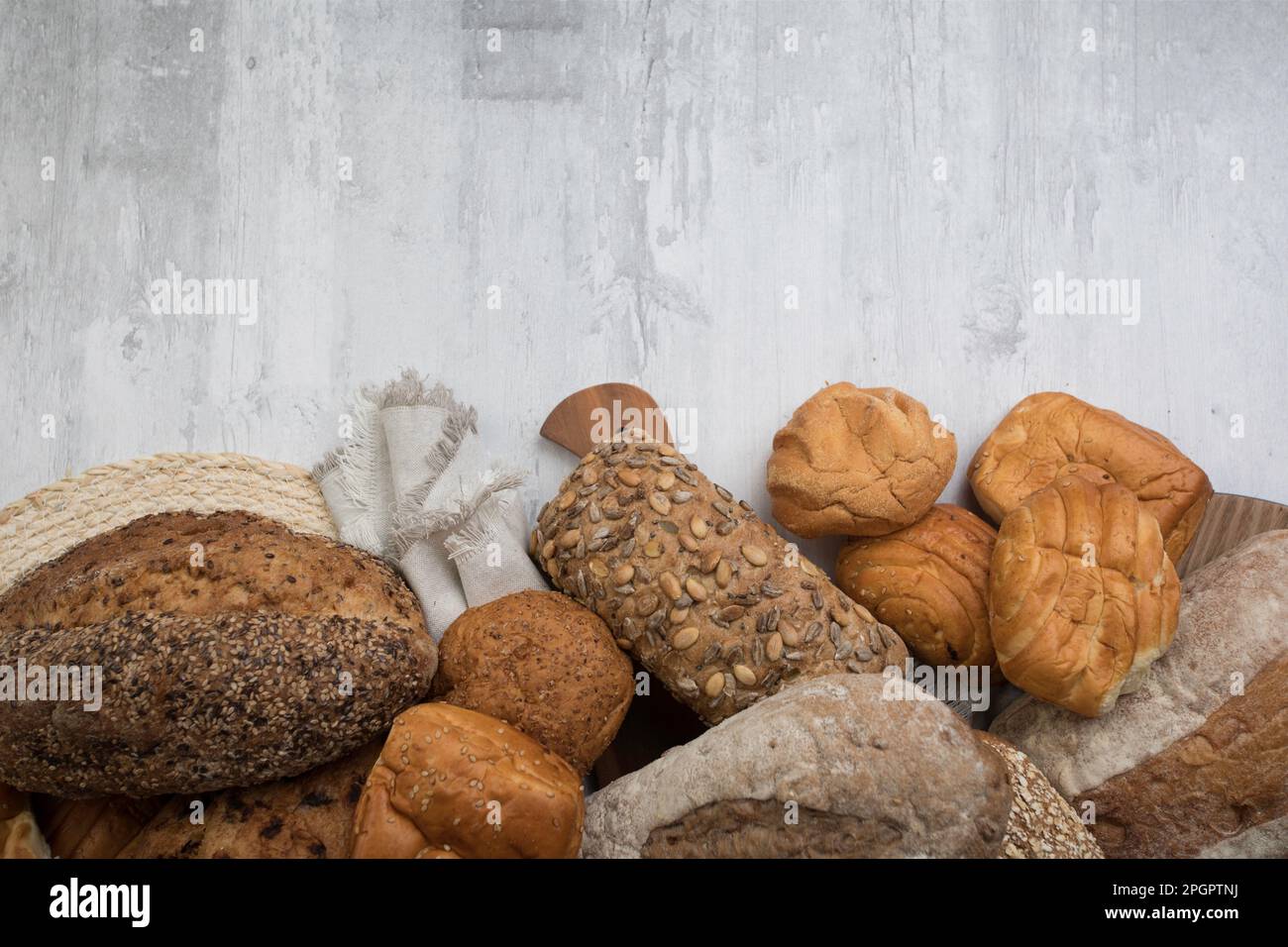 Types of bread on a wooden table Stock Photo - Alamy