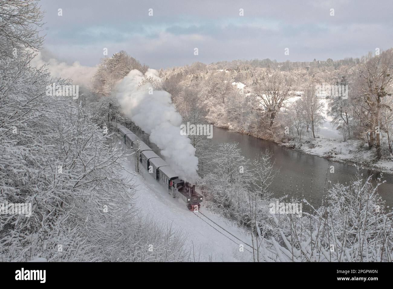Winter steam locomotive ride of the Steyrtalbahn museum railway along ...